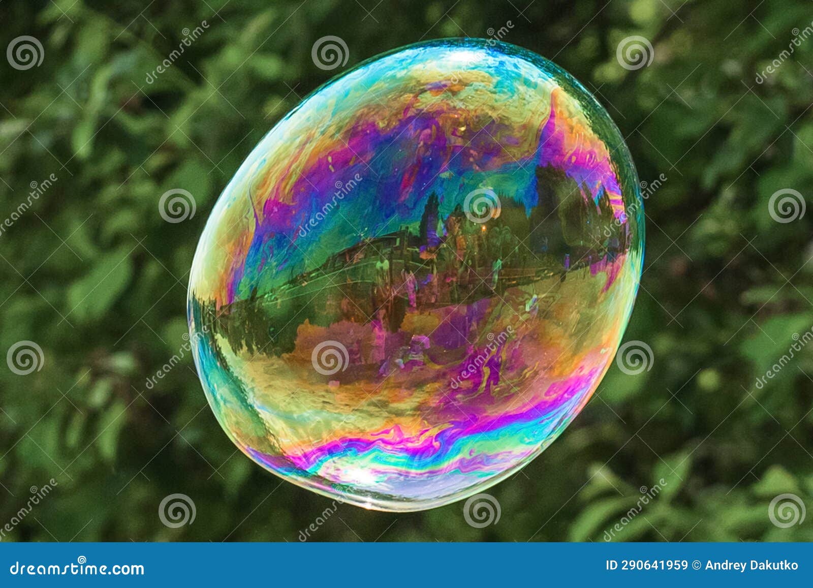 Large Soap Colored Ball Bubble Close-up on Blurred Green Background ...