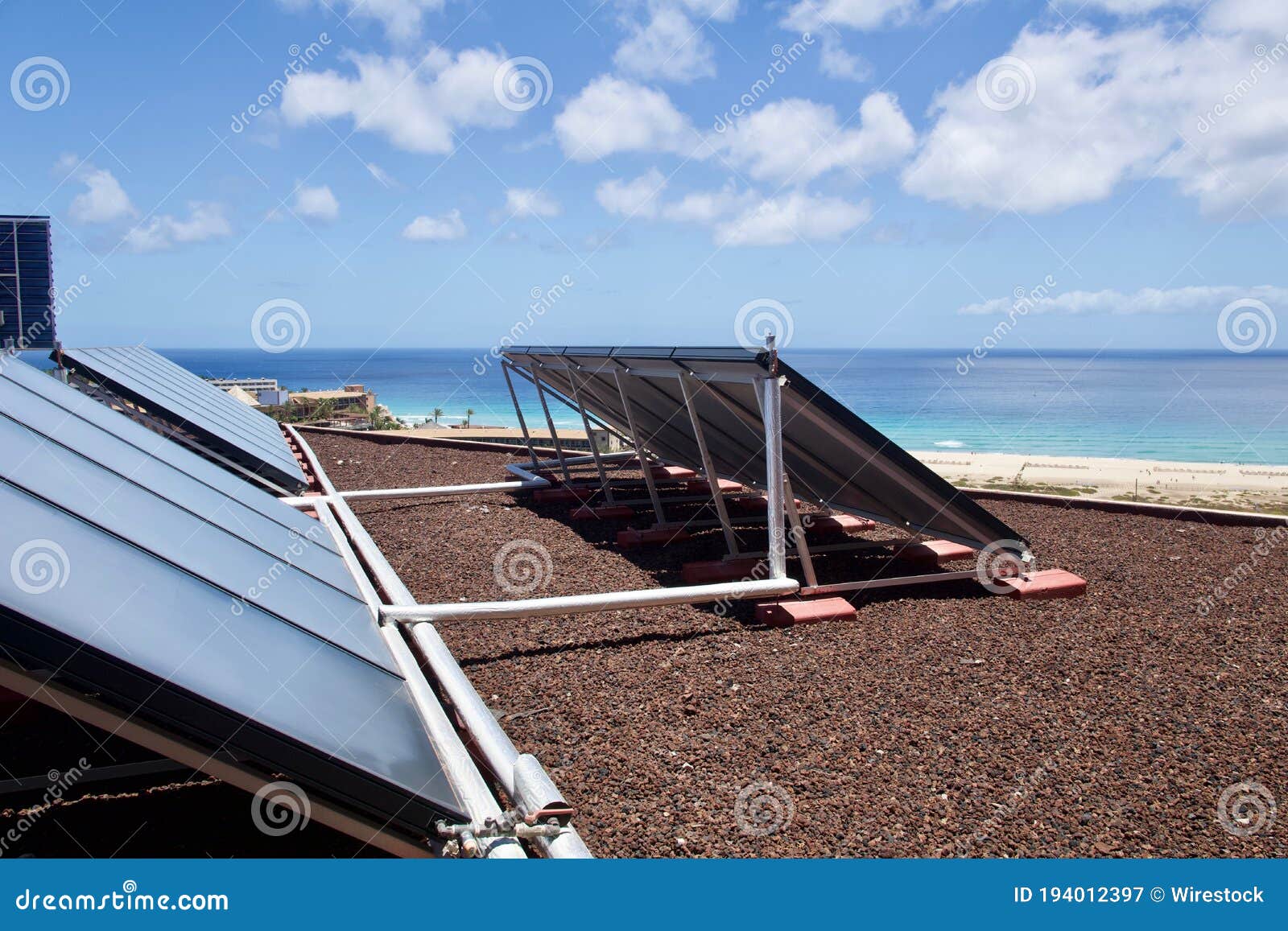 Large Solar Panels on a Beach with a Bright Cloudy Sky Stock Image ...