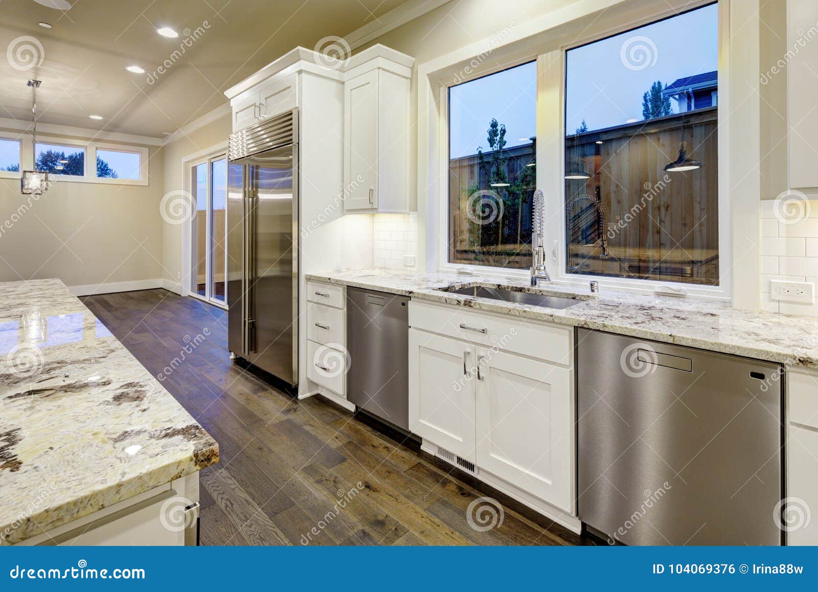 Large, Spacious Kitchen Design with White Kitchen Cabinets Stock Photo ...