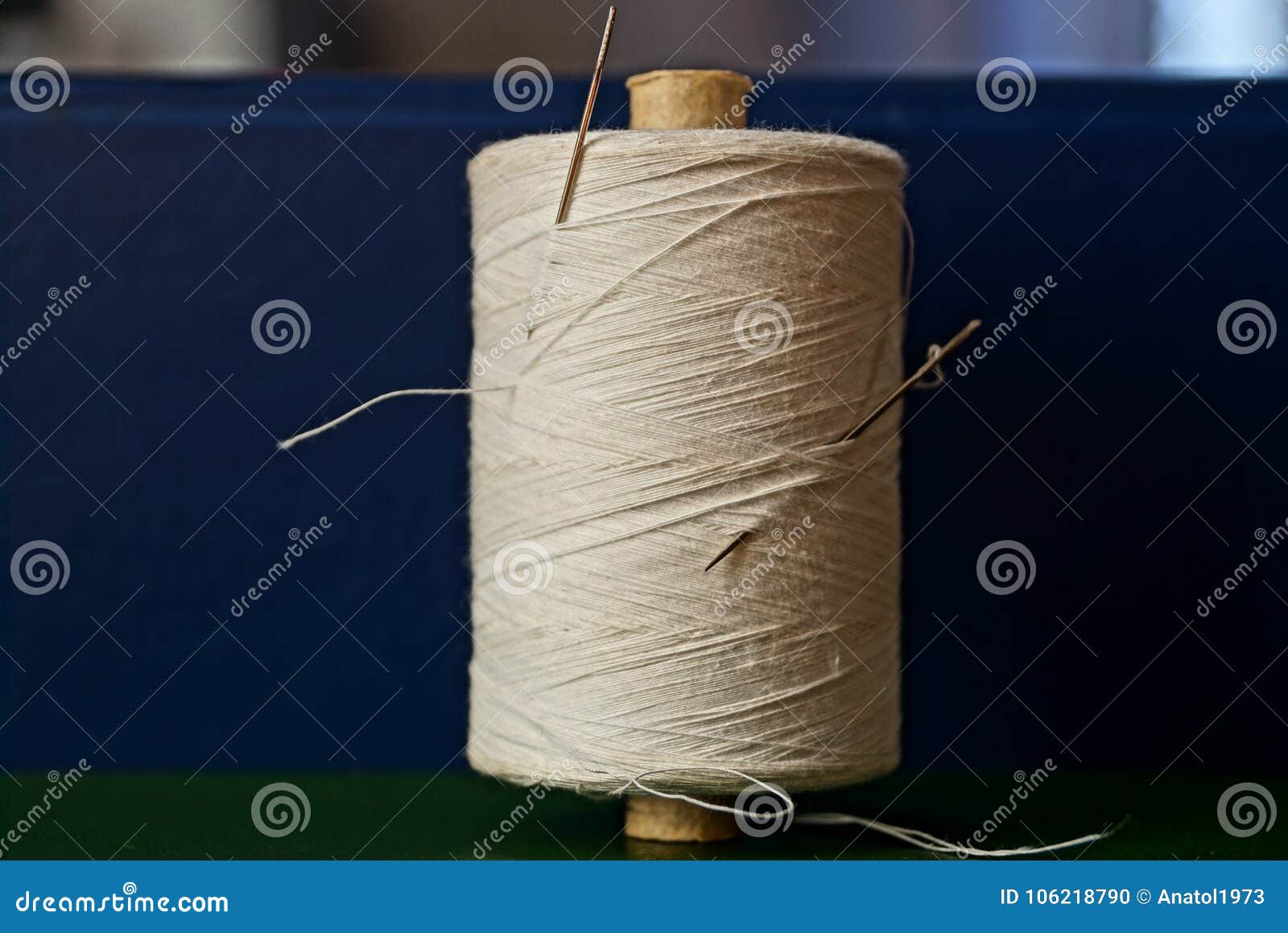 Large Spool of White Thread with Needles Stock Photo - Image of ...