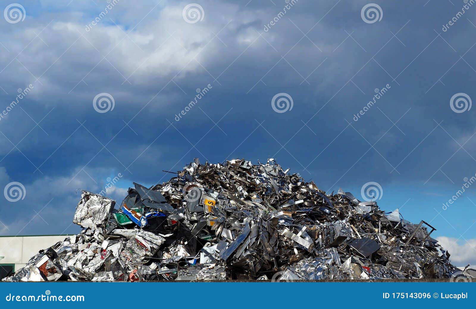 Large Stack of Aluminum and Ferrous Materials Scrap Shines Under the ...