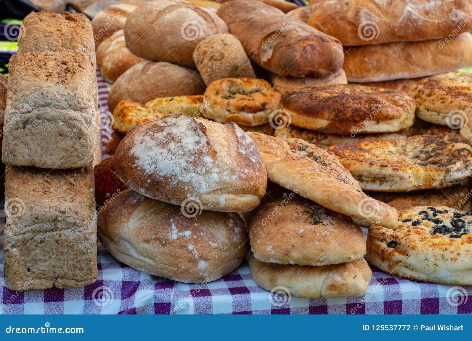 Large Stack of Artisan Bread Standing on Counter Stock Photo - Image of ...