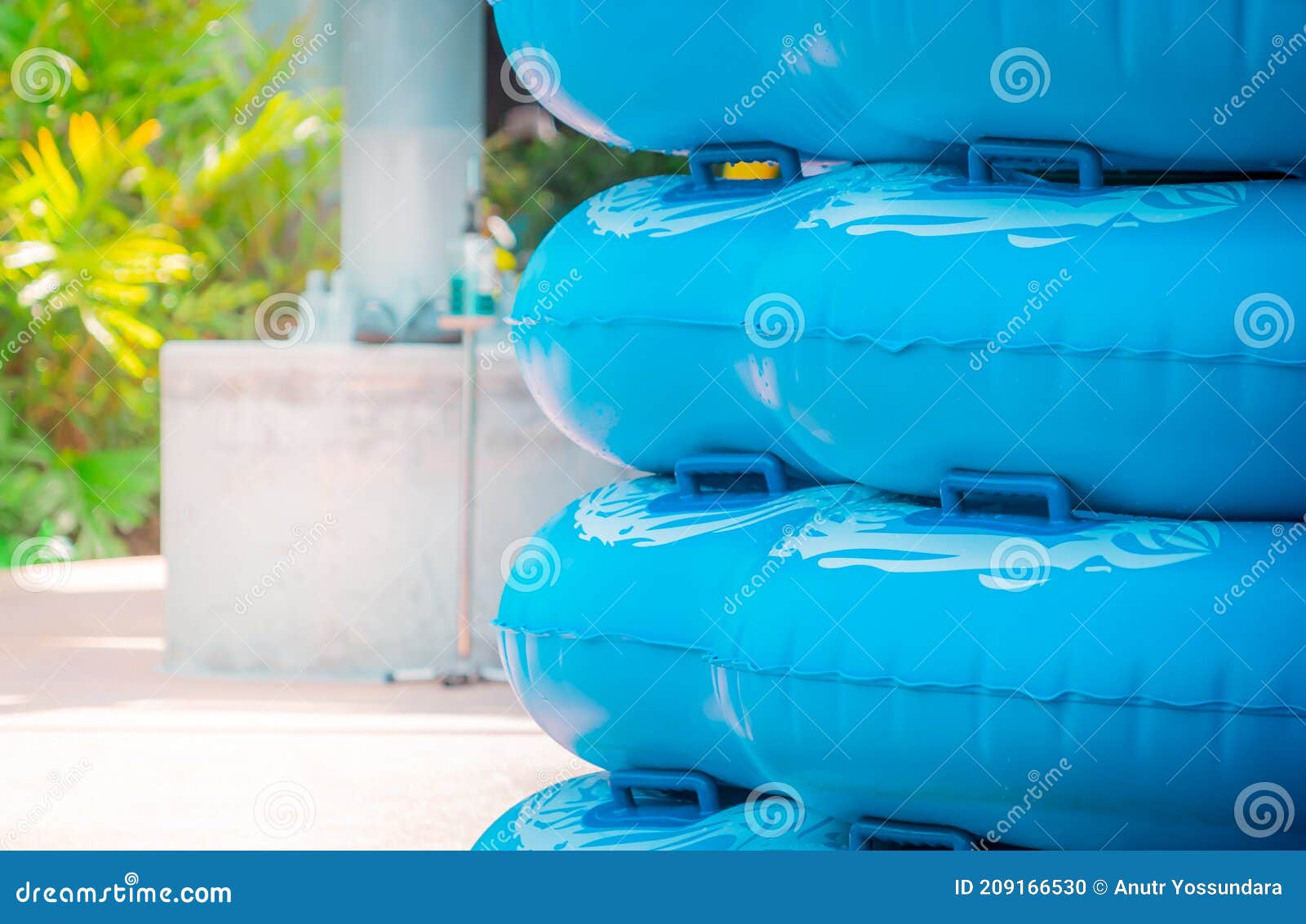 Stack of Blue Swim Ring for Water Park Slide on Water Park Pool Side ...