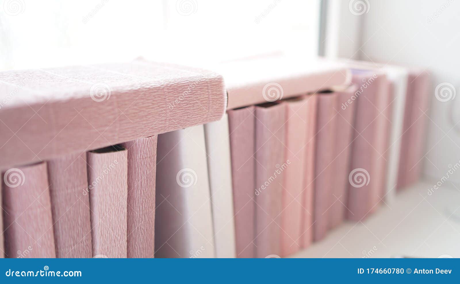 Large Stack of Books on Windowsill. Books Wrapped in Colored Paper Lie ...