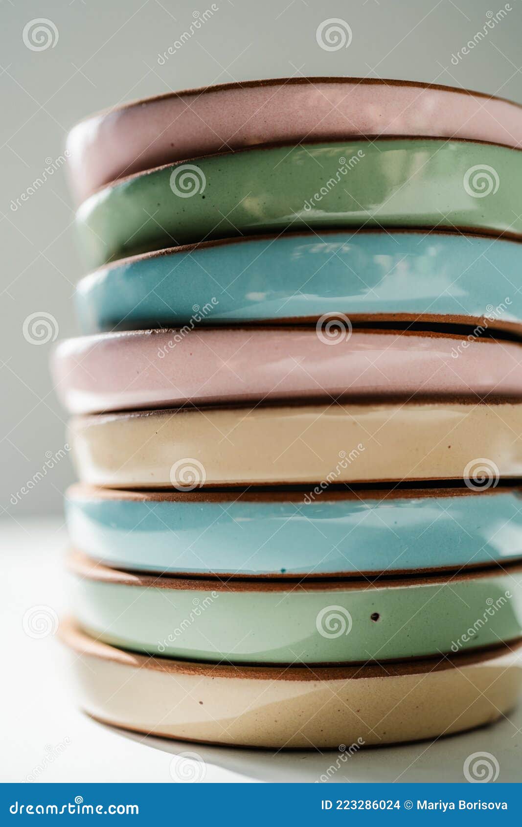 A Large Stack of Ceramic Cups in Pastel Colors. Stock Photo - Image of ...