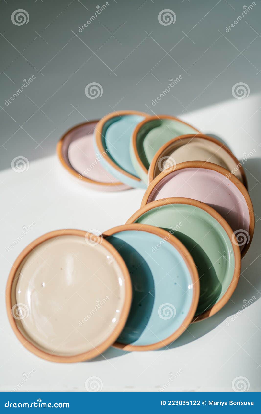 A Large Stack of Ceramic Cups in Pastel Colors. Stock Photo - Image of ...