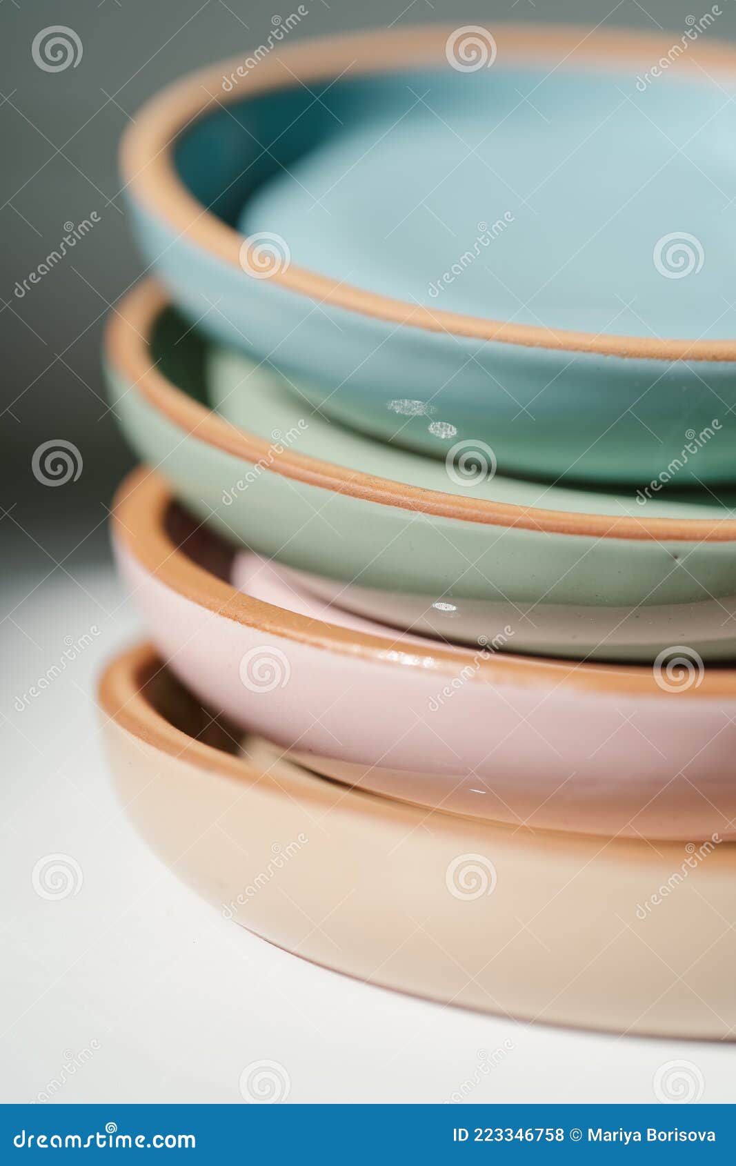 A Large Stack of Ceramic Cups in Pastel Colors. Stock Photo - Image of ...