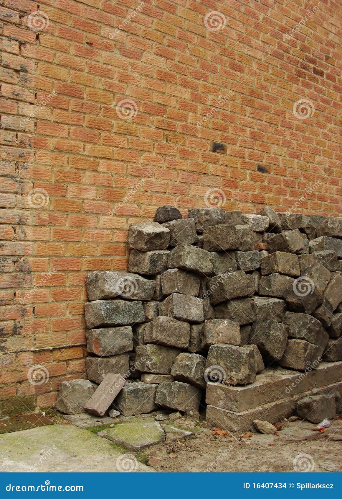 Large Stack of Cobbles in Front of a Brick Wall Stock Photo - Image of ...