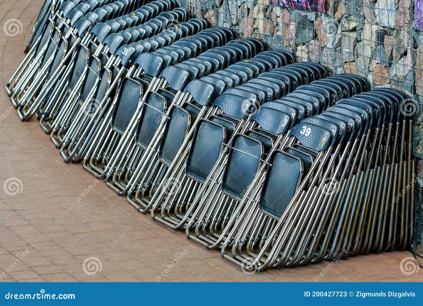 A Large Stack of Folding Chairs in the Concert Hall Stock Image - Image ...