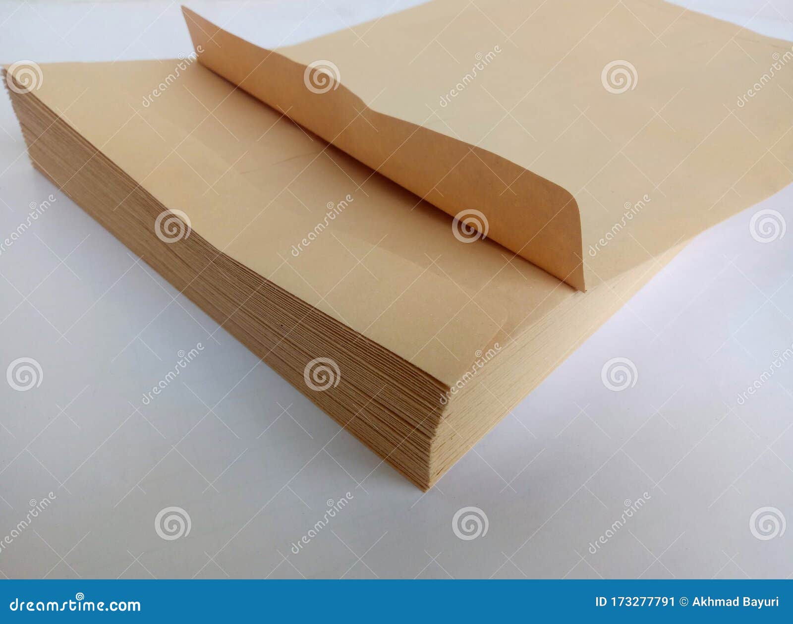 A Large Stack of Plain Brown Envelopes with a White Background Stock ...