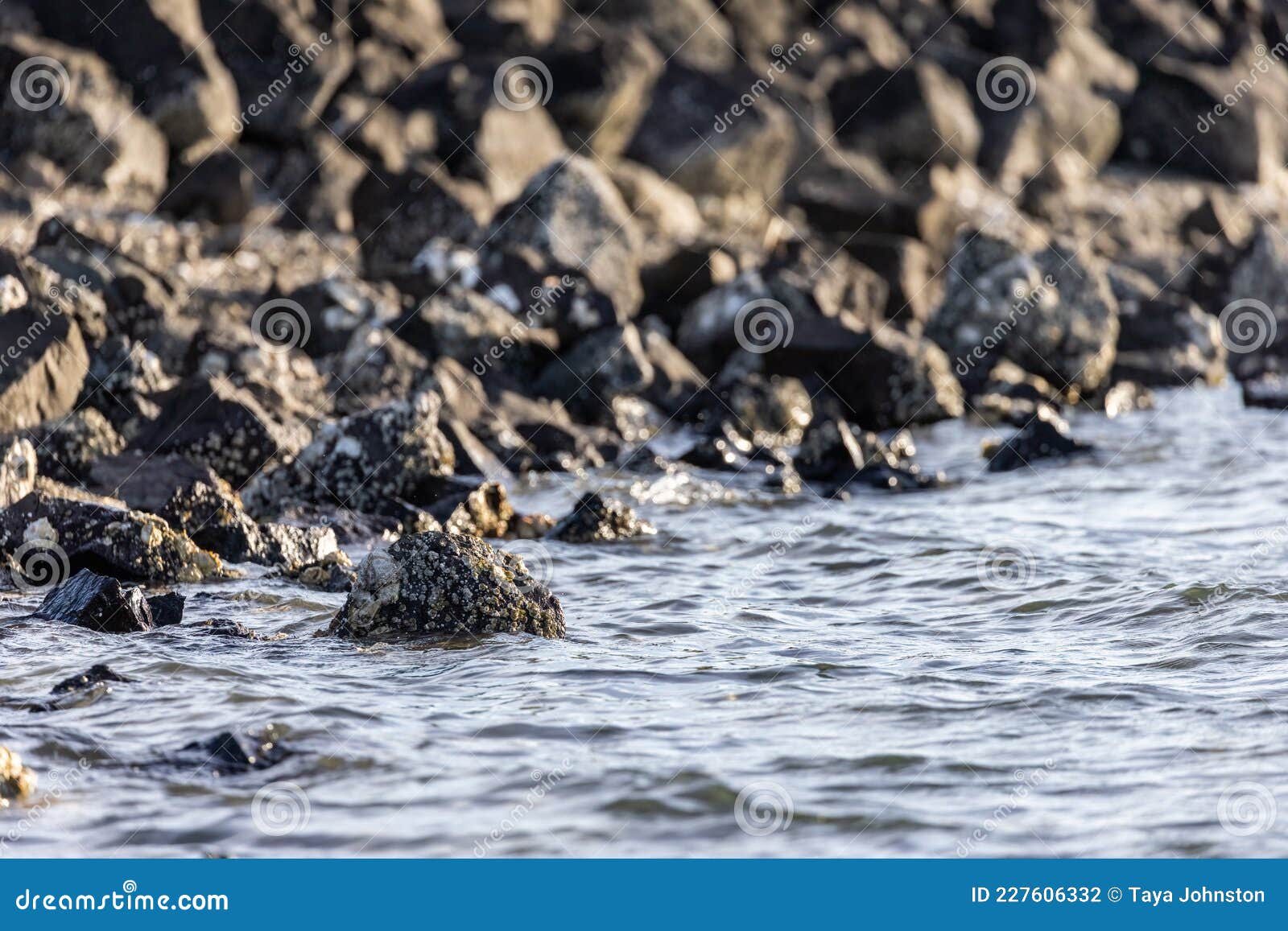 Large Stacked Rocks On A Beach With Waves Royalty-Free Stock ...