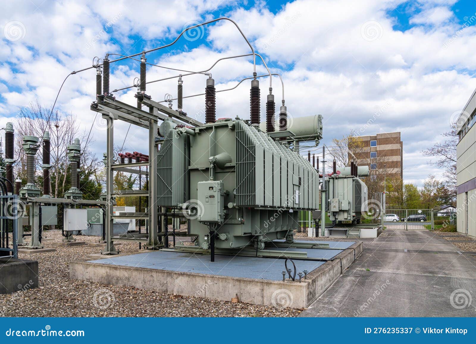 A Large Stationary Electrical Transformer Against a Cloudy Sky. Stock ...