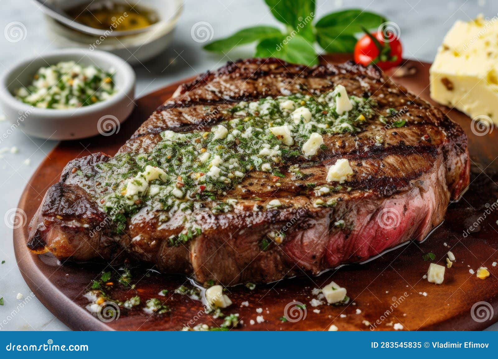Large Steak is Sitting on Board with Some Spinach Green Sauce on Side ...