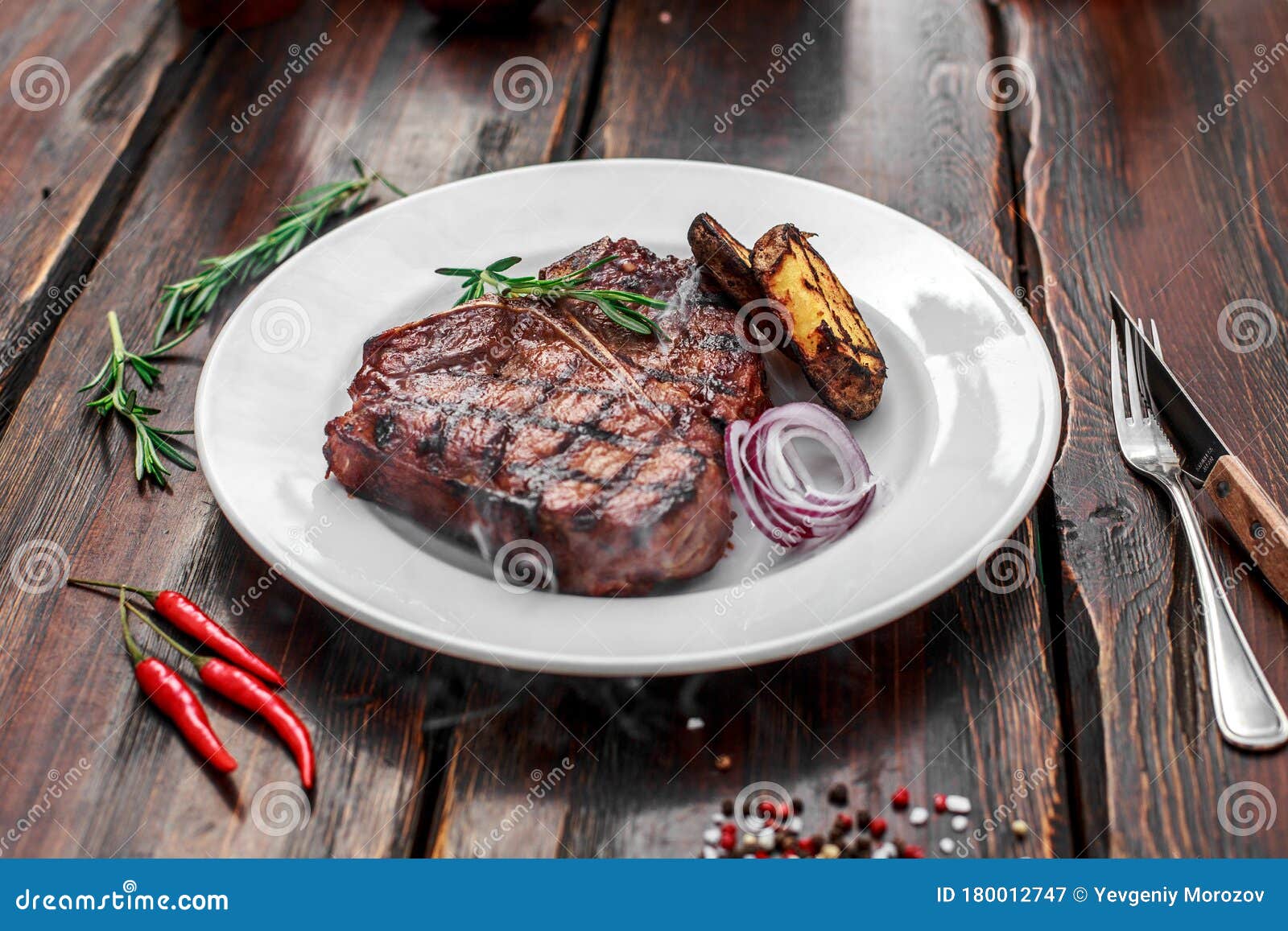 A Large Steak with Spices and Vegetables on the Grill Stock Image ...