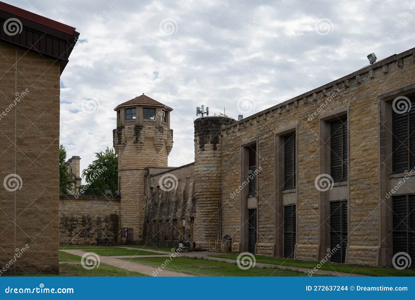 A Large Stone Building with a Clock Tower in the Middle Stock ...
