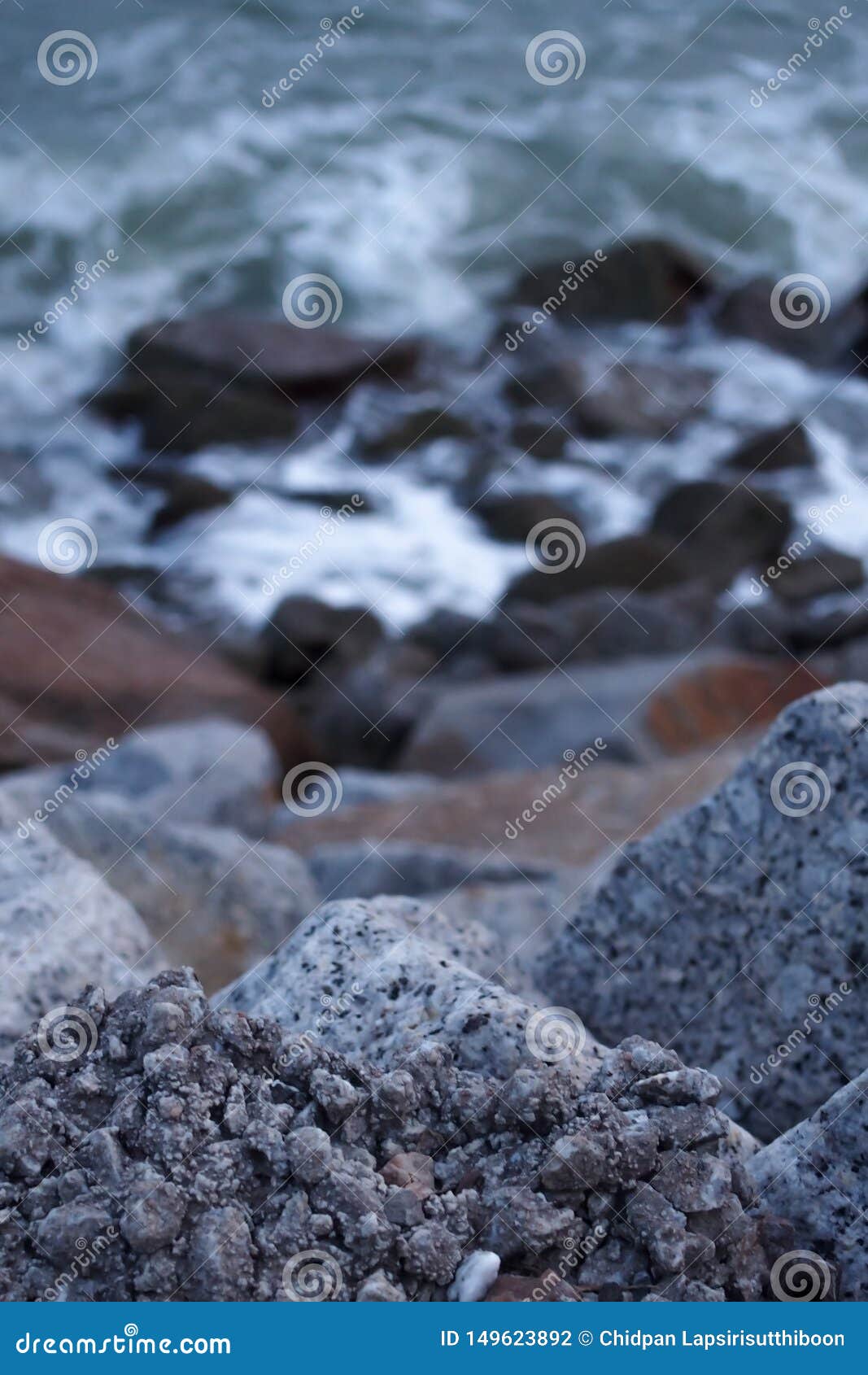 A Large Stone Overlapping by the Sea Stock Photo - Image of black ...