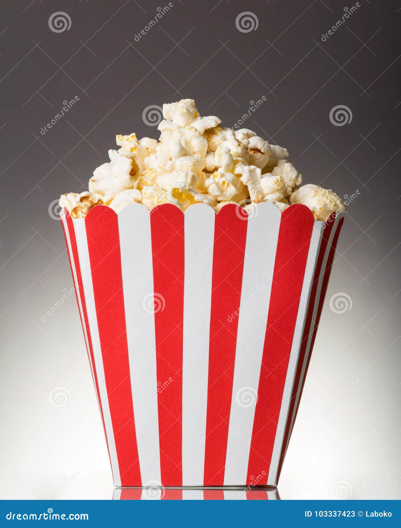 Large Striped Square Box Filled with Popcorn on Gray Background. Stock ...