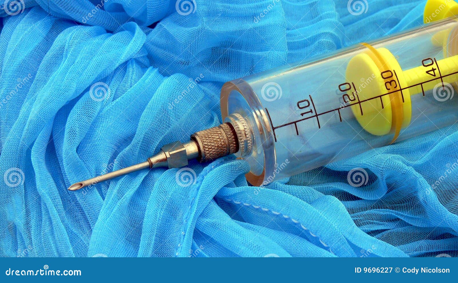 Large syringe on blue stock image. Image of safety, health - 9696227