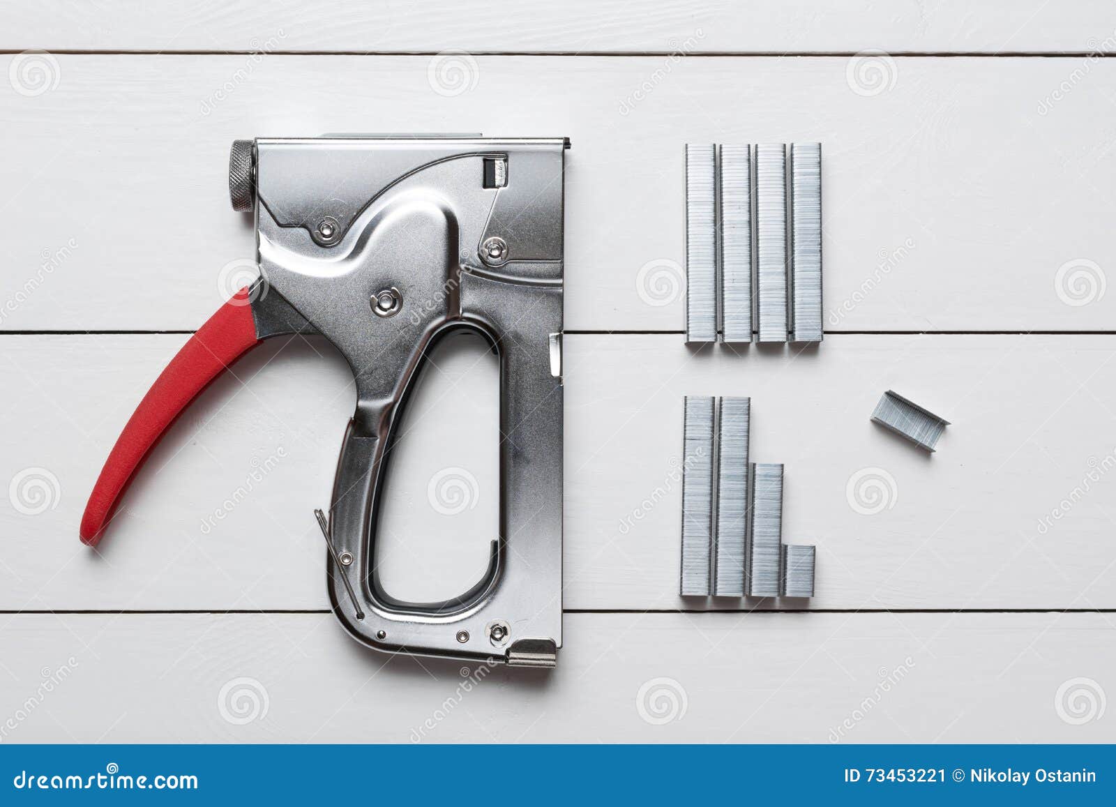 Large Tacker Stapler Gun with Clips on Wooden Floor Stock Image - Image ...
