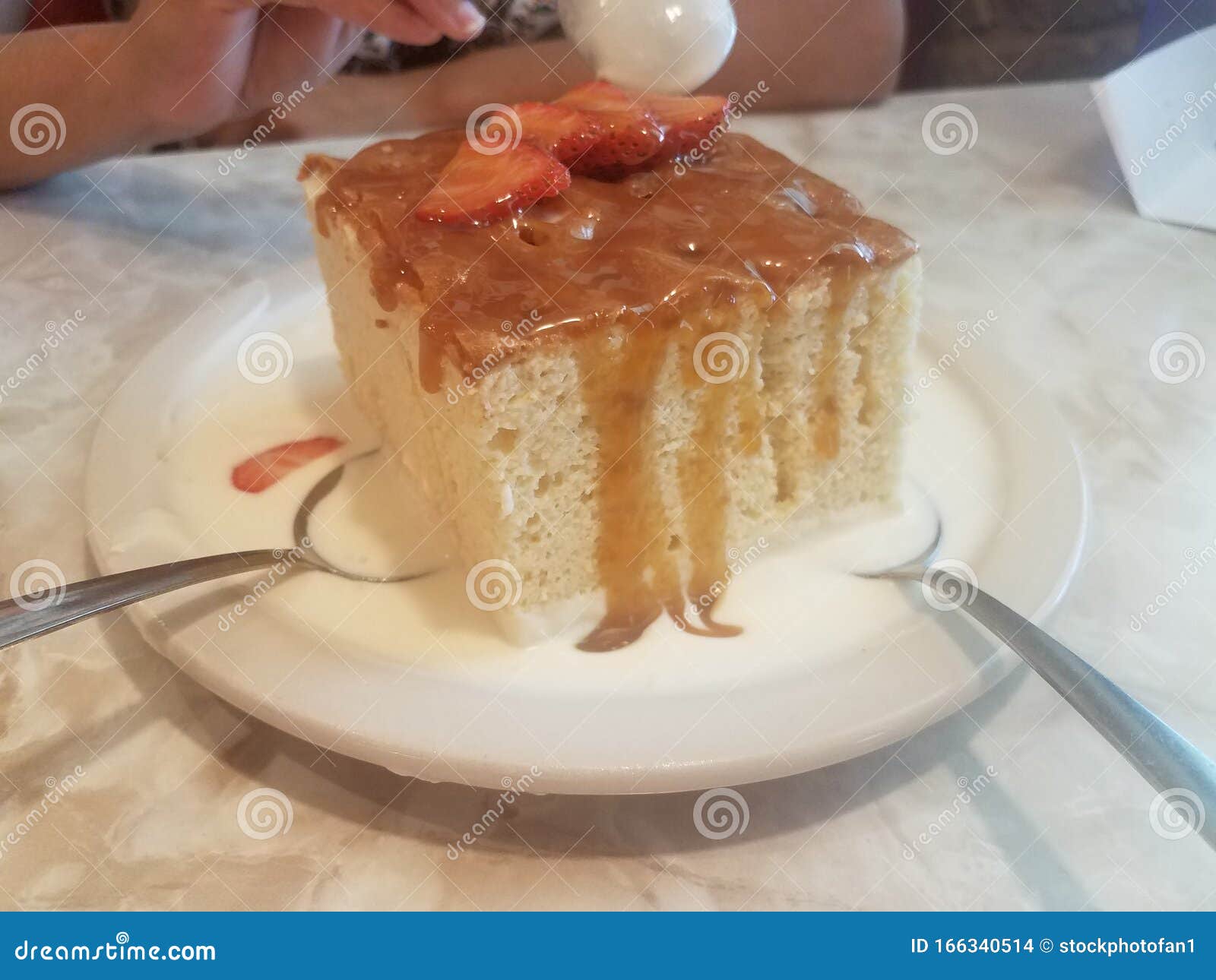 Large Three Milk Cake from Puerto Rico on Plate with Spoons Stock Photo ...