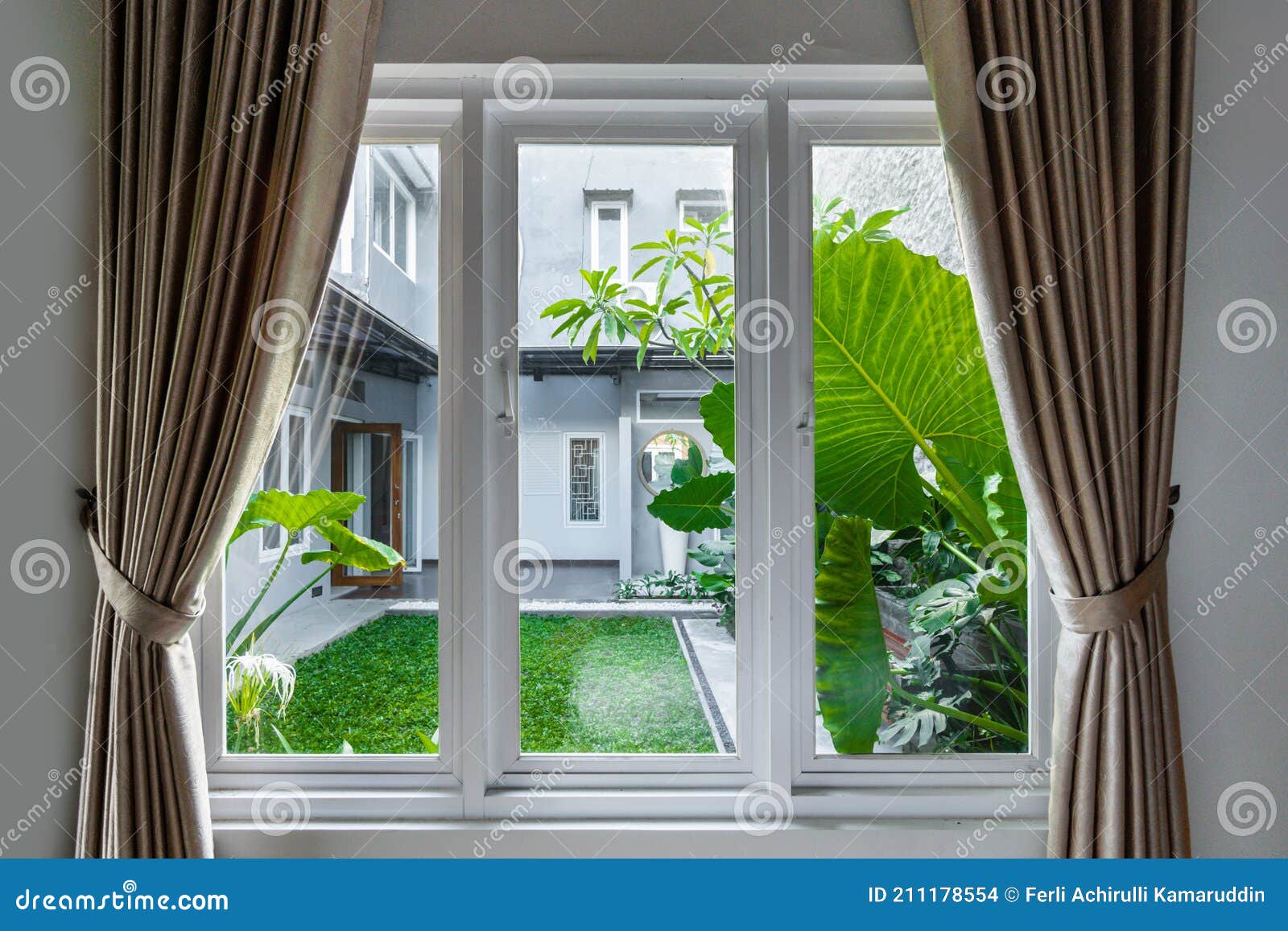 Large Three Pane Window Looking on Summer Backyard with Garden Stock ...