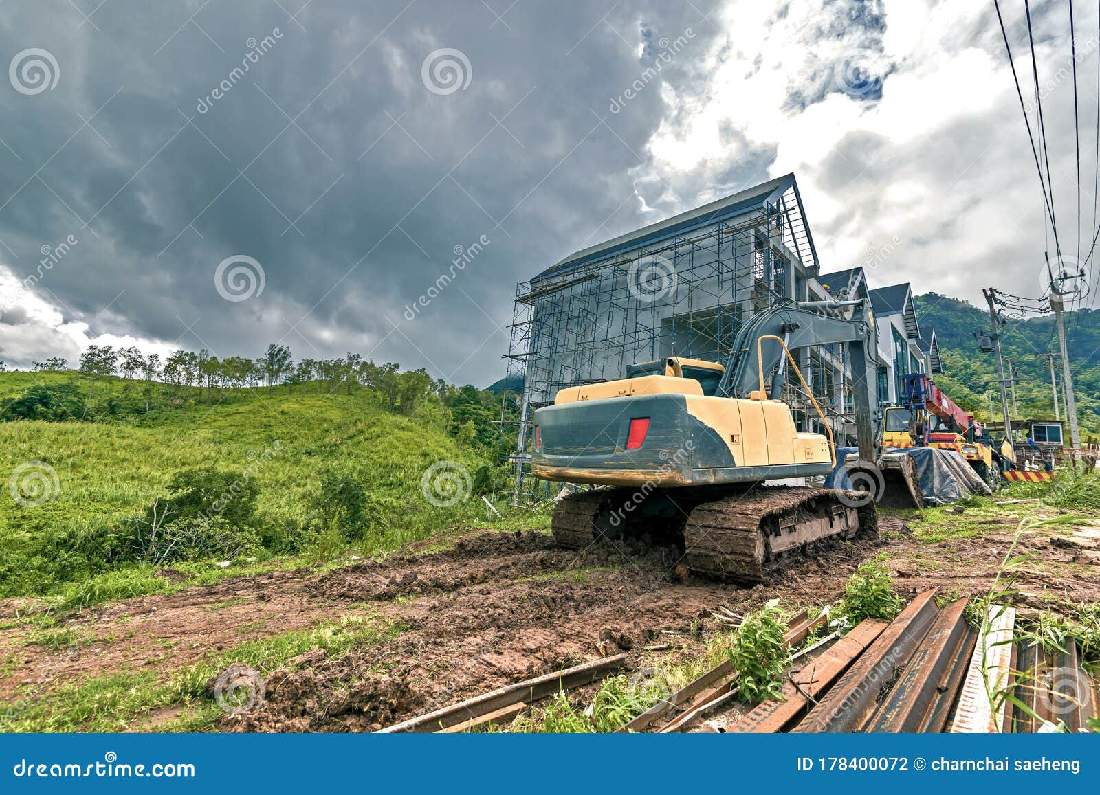 Large Tracked Excavator Digs the Ground for the Foundation and ...