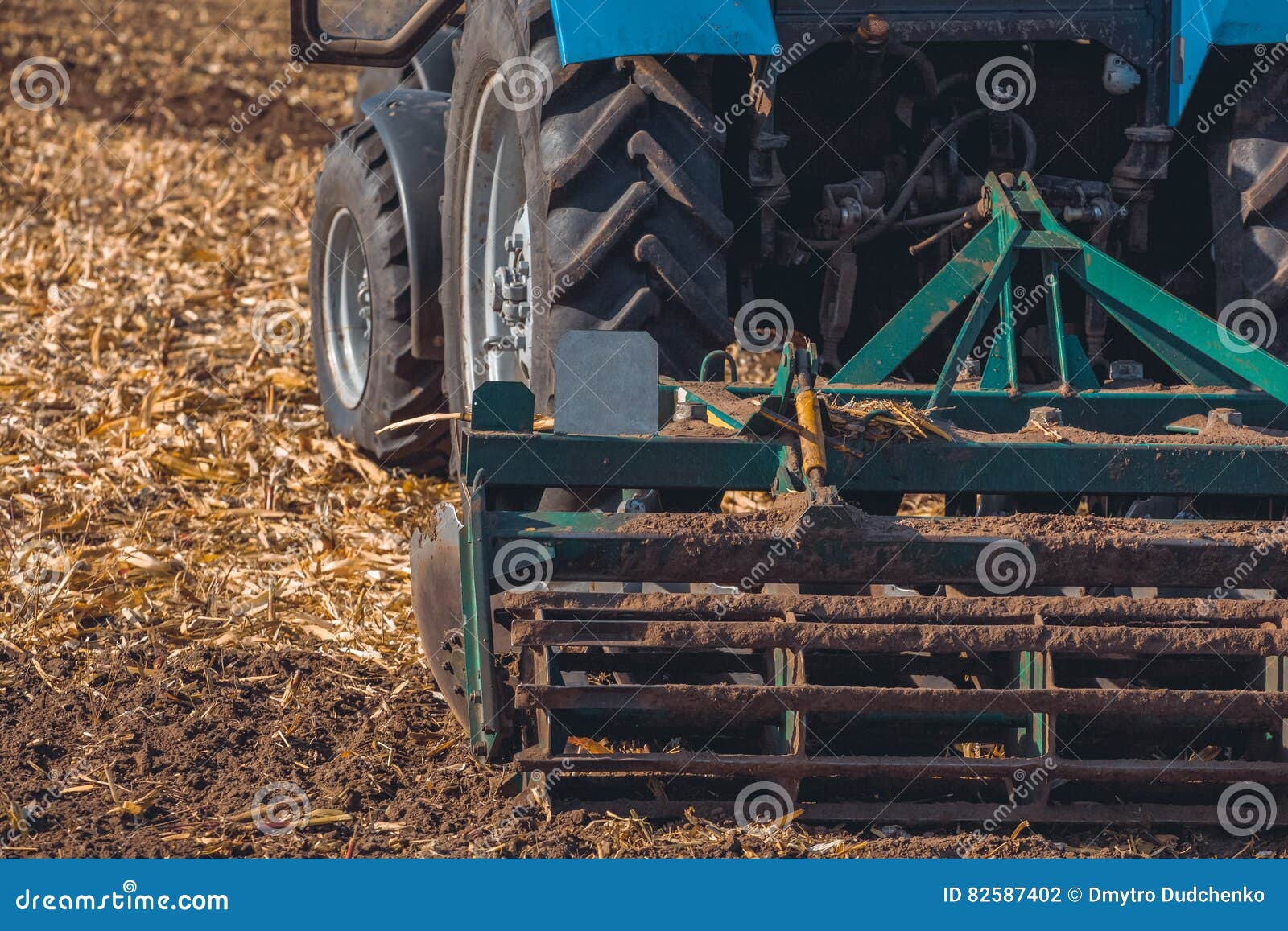 Large Tractor Pulling a Plow and Plow the Field, Remove the Remnants of ...