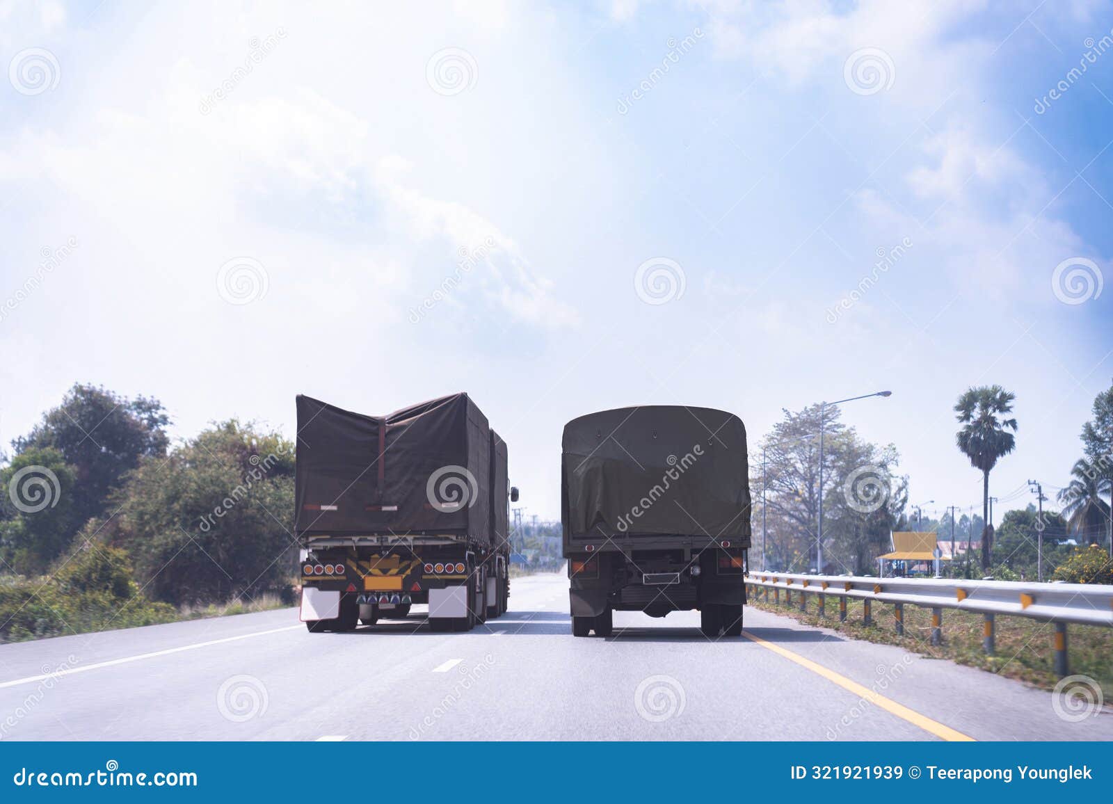 Large Trucks Drive Side by Side while Overtaking on the Highway Stock ...