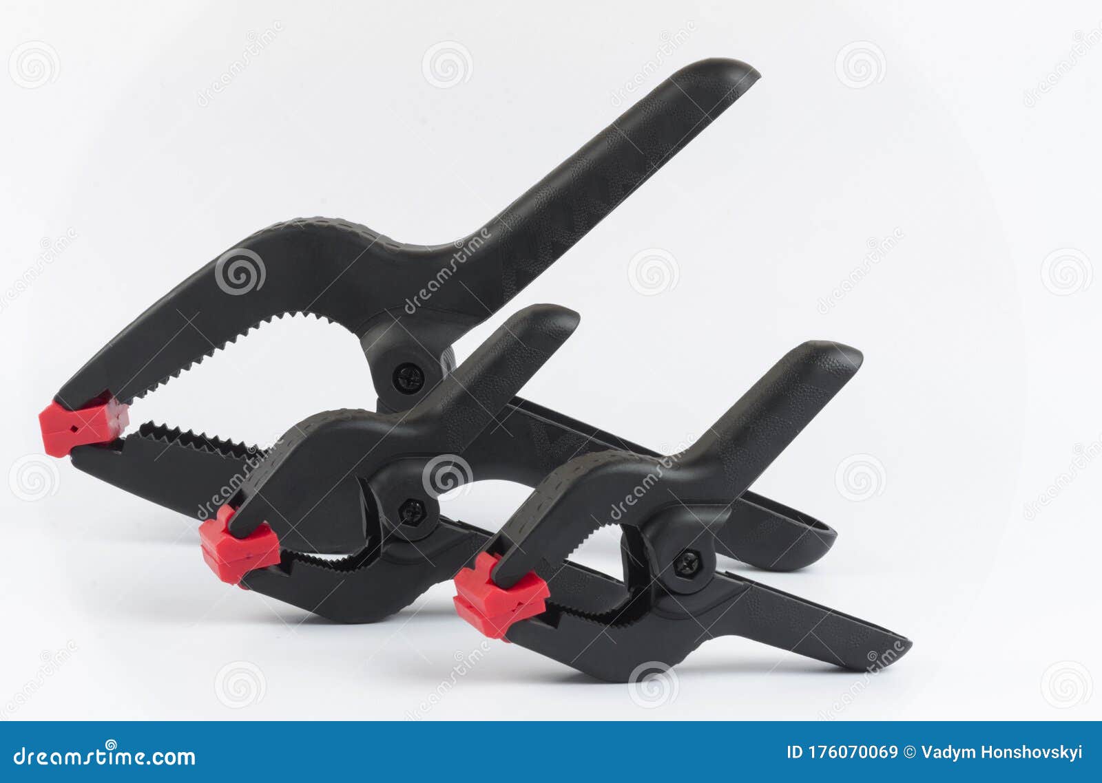 Large and Two Small Plastic Clamps on a White Background Stock Image ...