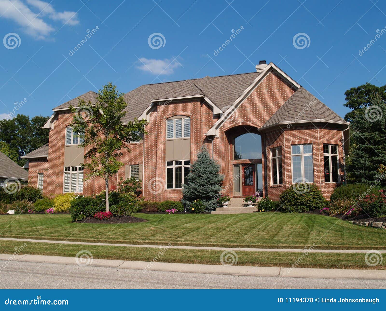 Large Two Story New Brick Home with Turret Stock Photo - Image of ...