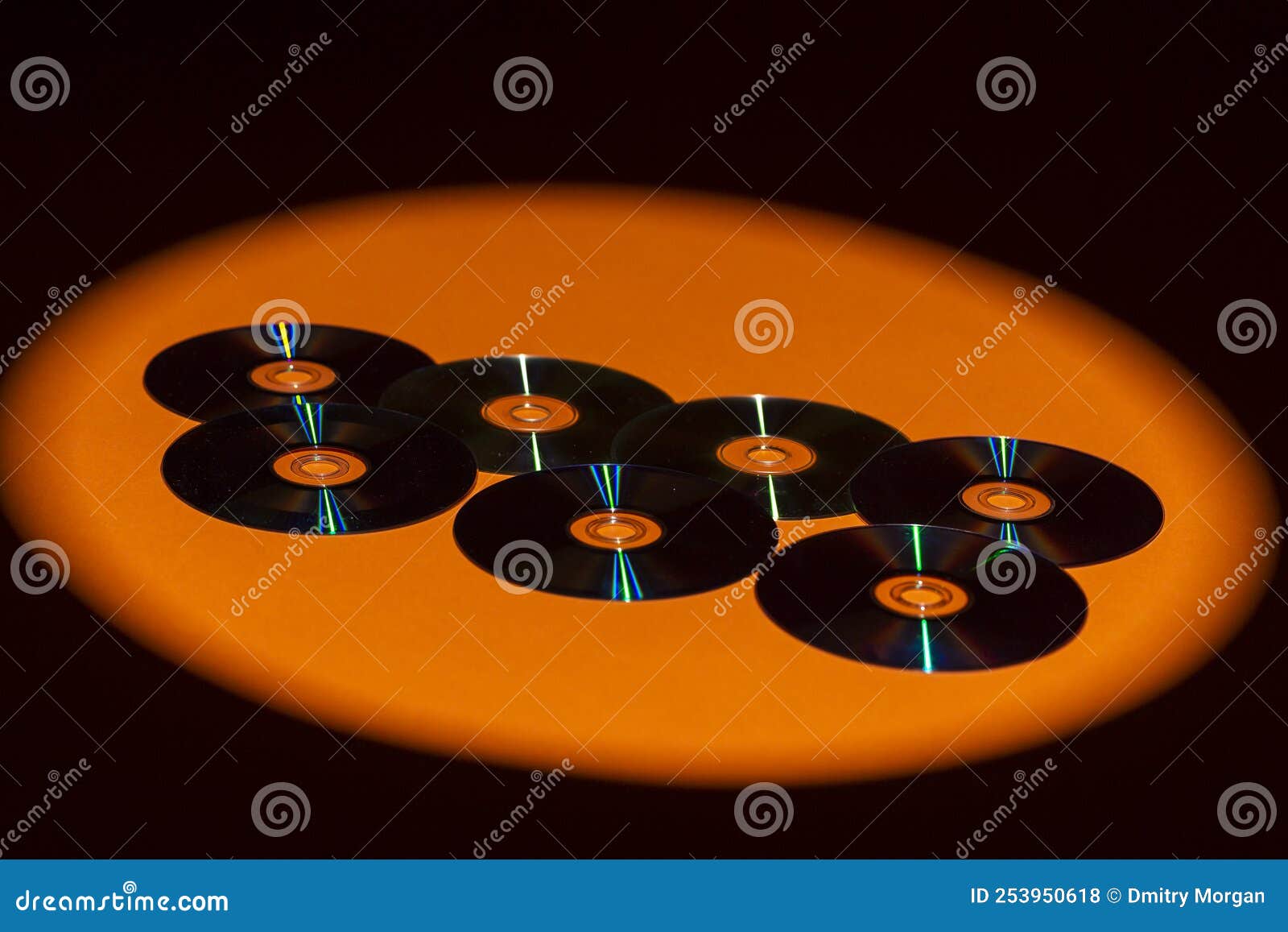Large Variety of Arranged CD Disks or DVD Disks on Orange Background ...