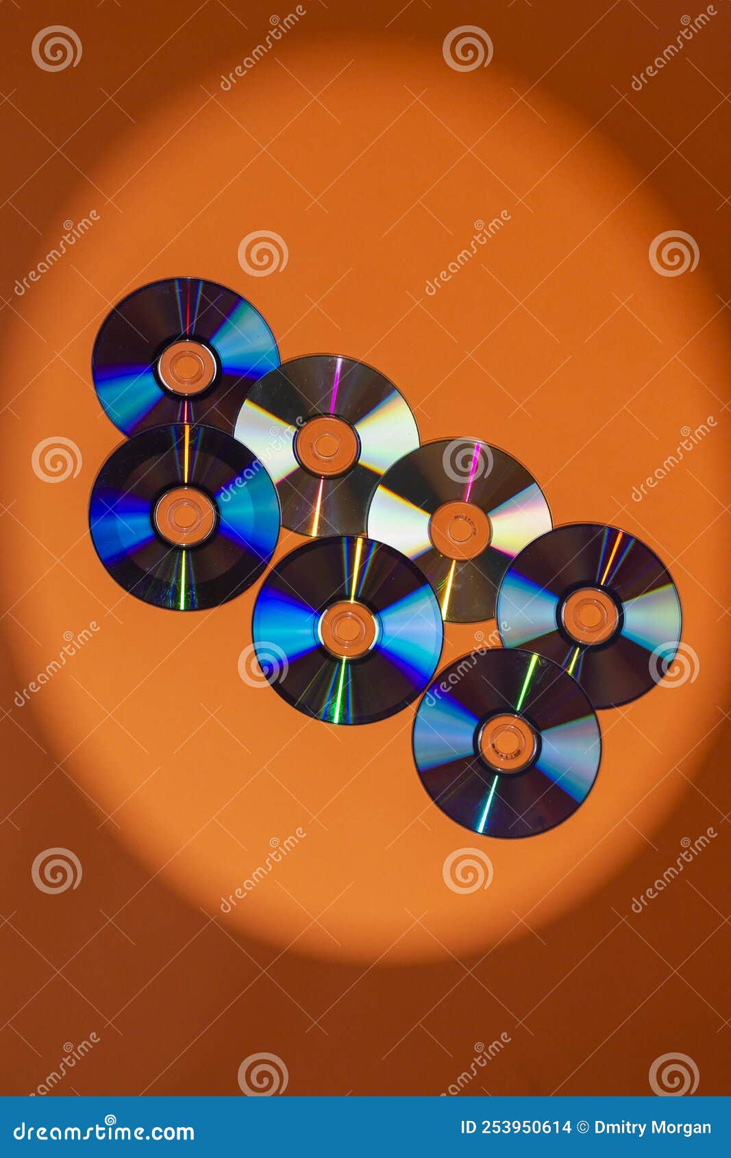 Large Variety of Arranged CD Disks or DVD Disks on Orange Background ...