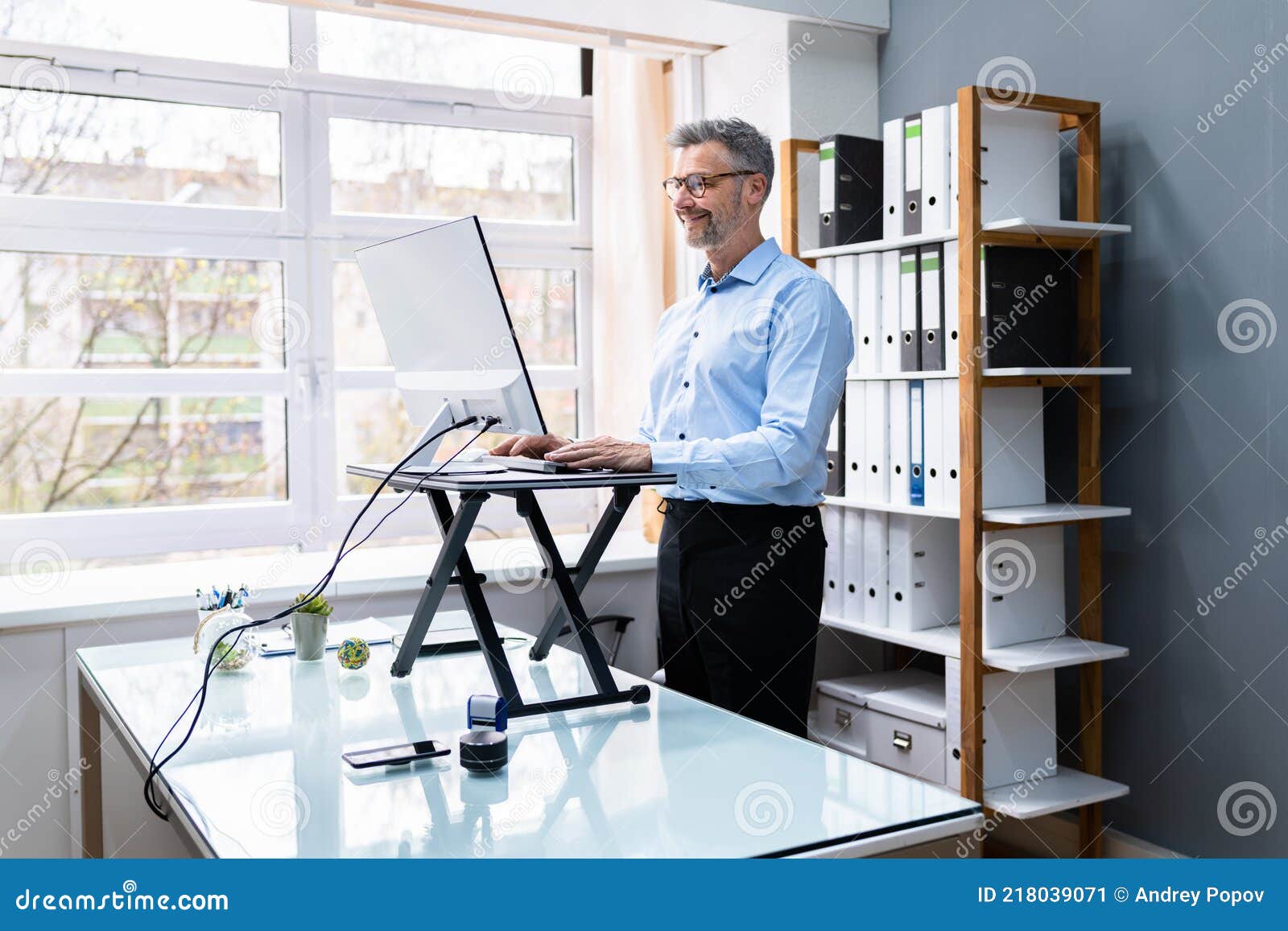 Large Version of Adjustable Height Desk Stand in Office Stock Image ...