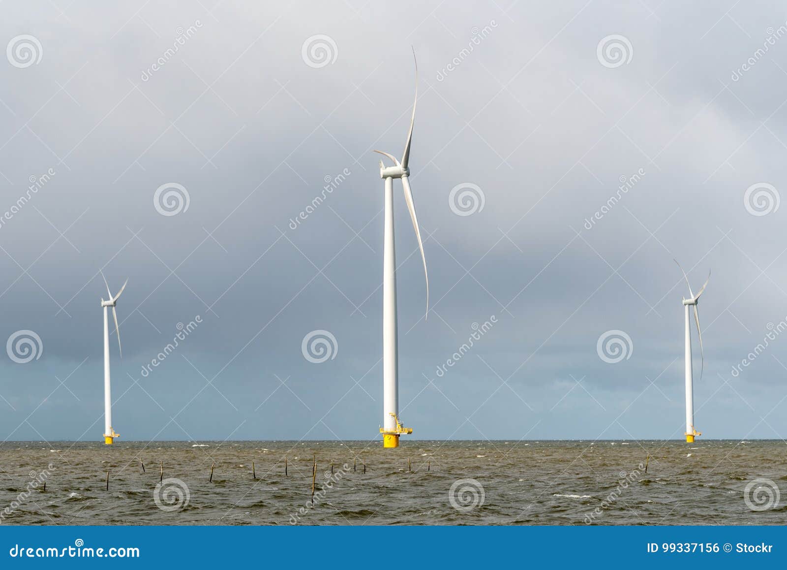 Windmills in the ocean stock photo. Image of mill, open - 99337156