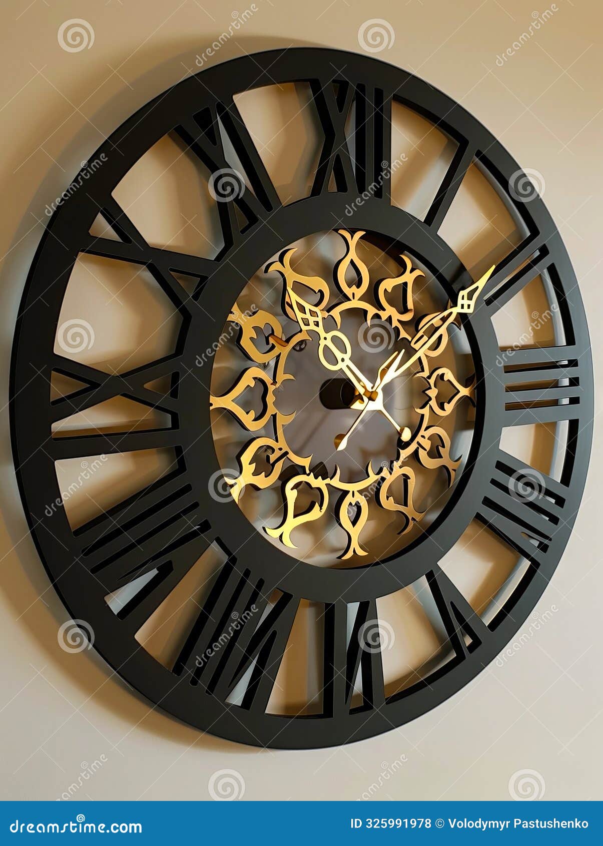 A Large Wall Clock with Roman Numerals and Gold Accents Stock Photo ...