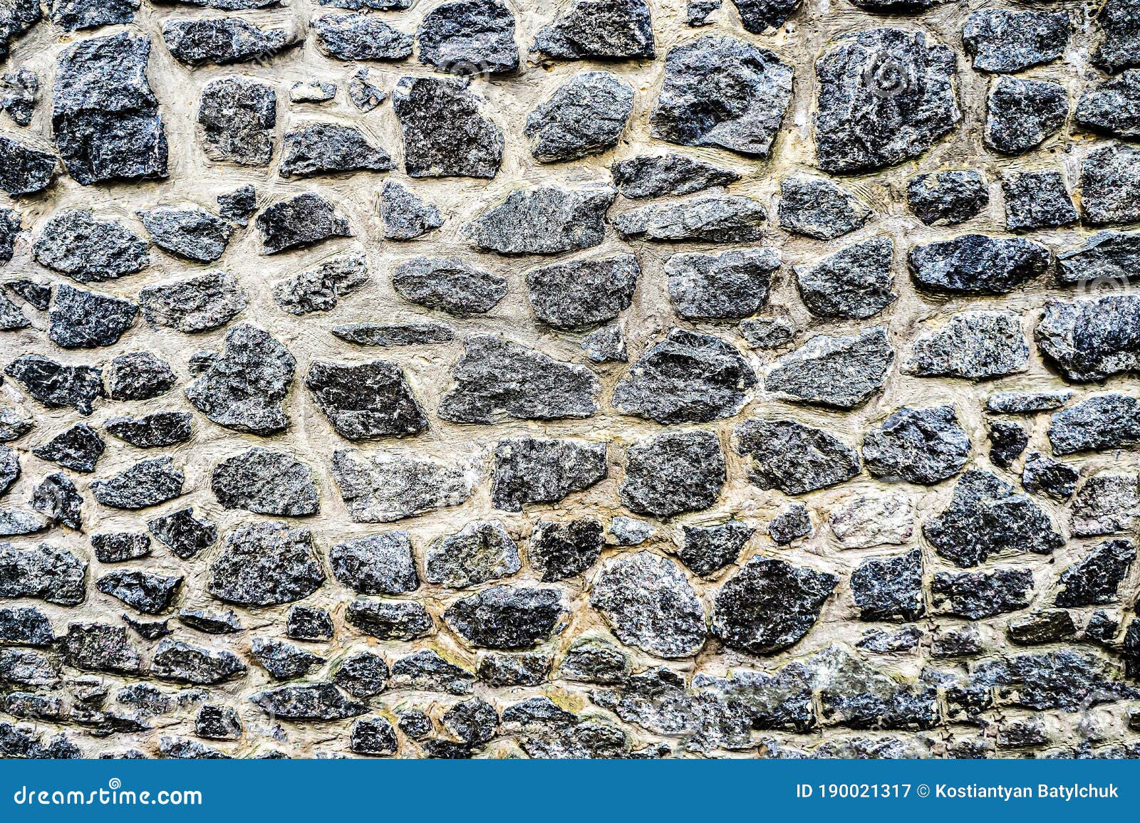 Large Wall of Natural Granite Stones of Different Size and Color Gray ...