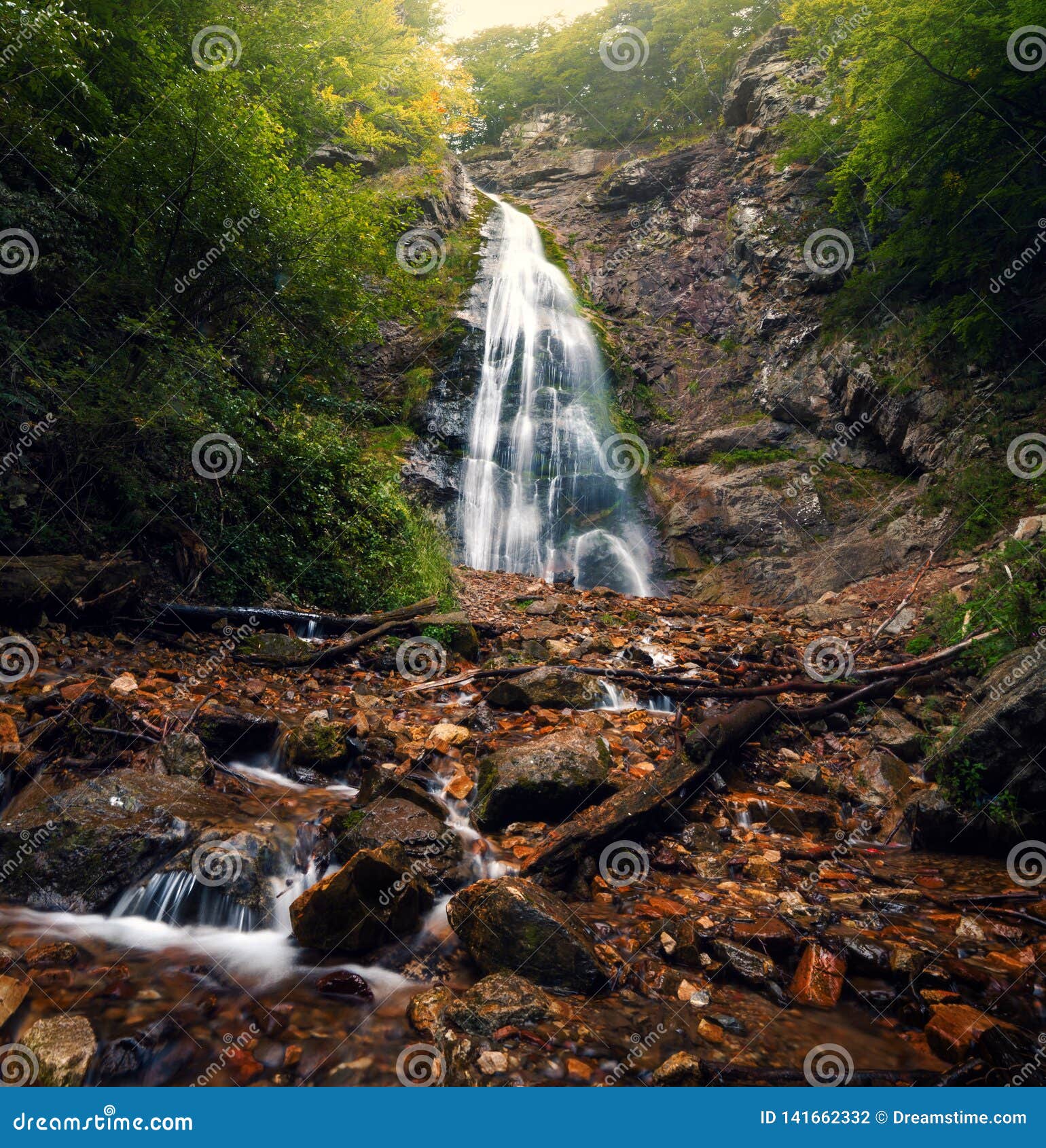 Large Waterfall in the Forest Stock Photo - Image of stream, rocks ...