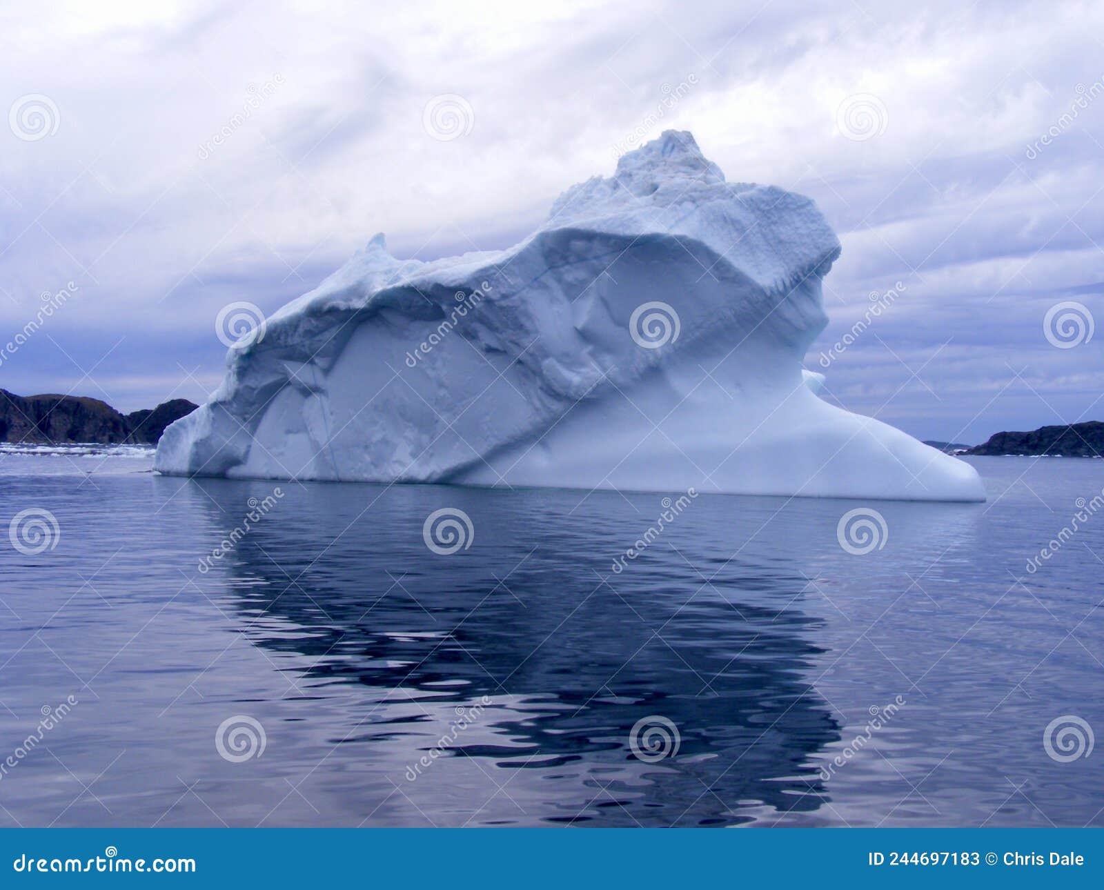 Large Wedge Shaped Iceberg Casting Reflection in Twillingate Harbour ...