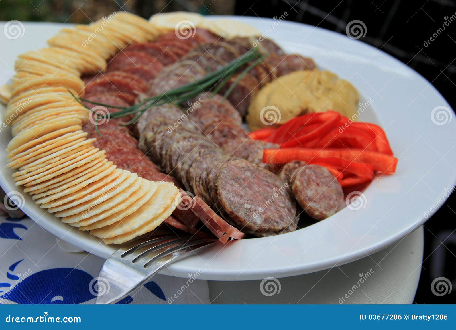 Large White Dish Covered with Array of Meats, Vegetables and Crackers ...