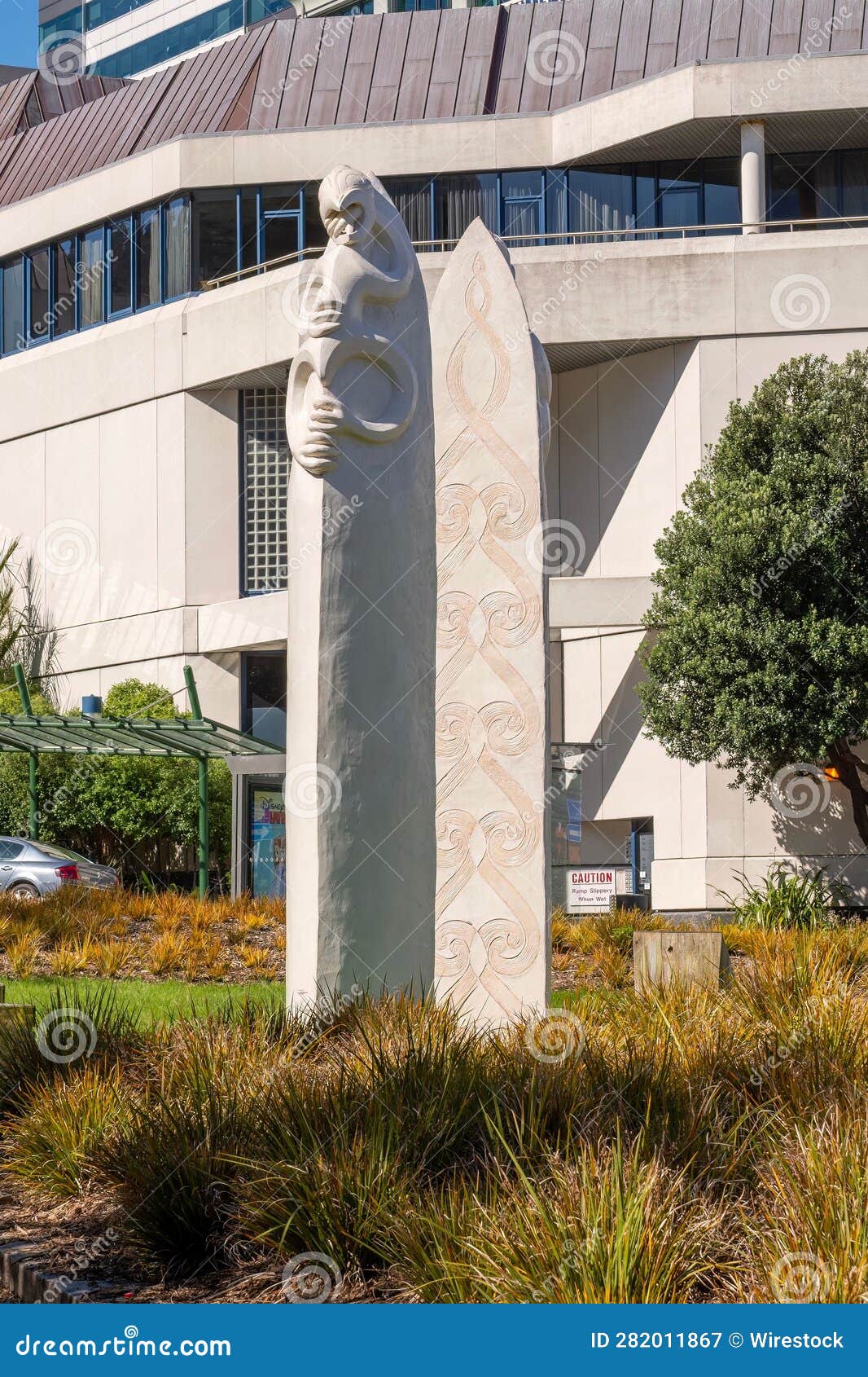 Large White Maori Totem Sculpture in Front of a Building in the Park ...