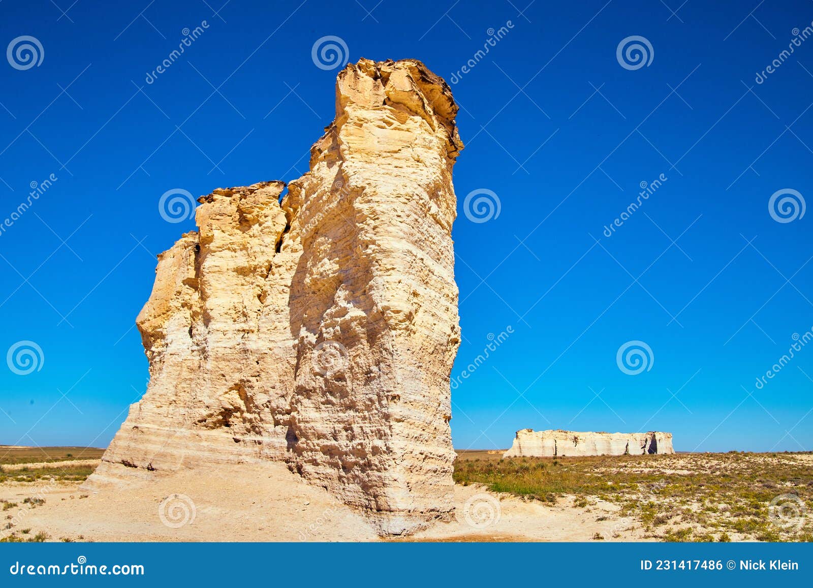 Large White Rock Pillars Sticking Out of Flat Desert and Bold Blue Sky ...