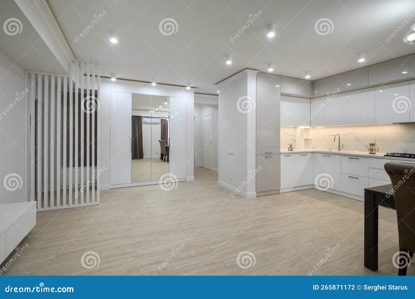Large White Room Connected To Hall and Kitchen in a Studio Flat Stock ...