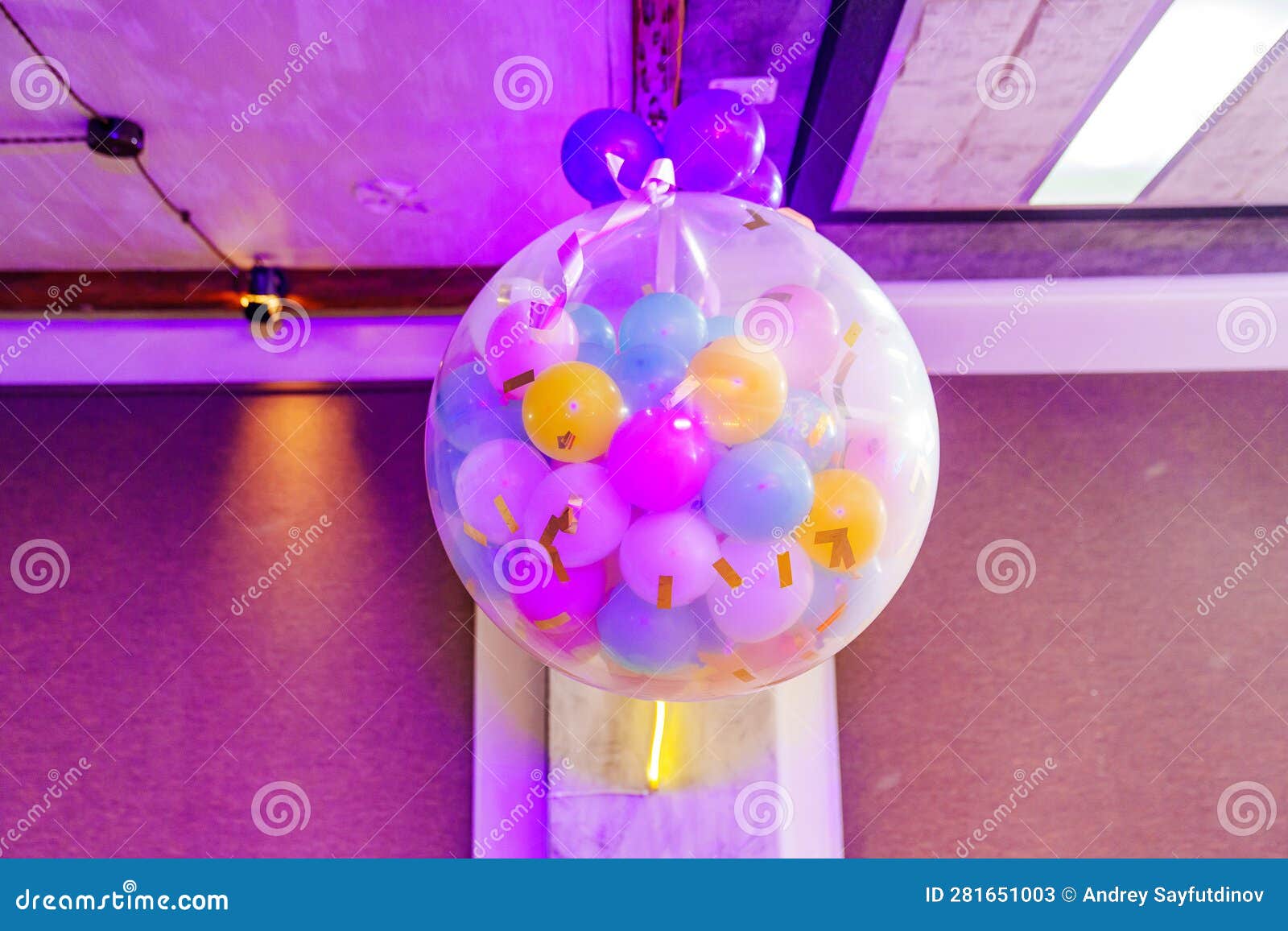A Large White Transparent Balloon with Small Multi-colored Balloons ...