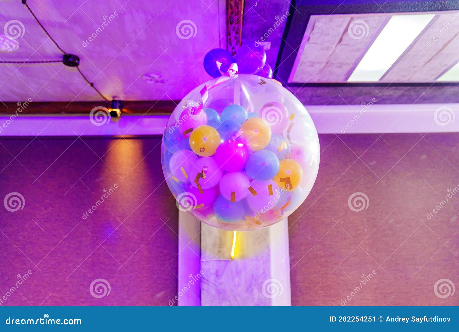A Large White Transparent Balloon with Small Multi-colored Balloons ...