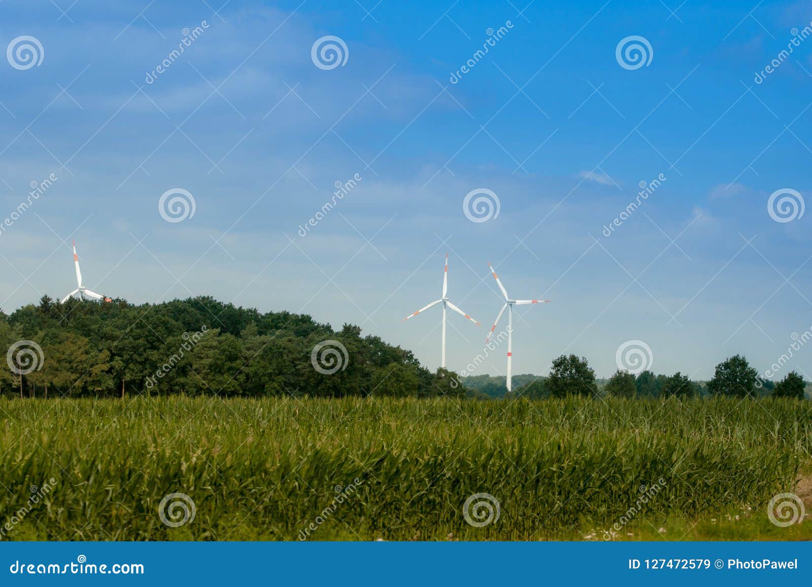 A Large Windmill on a Background of Blue Sky with White Clouds ...