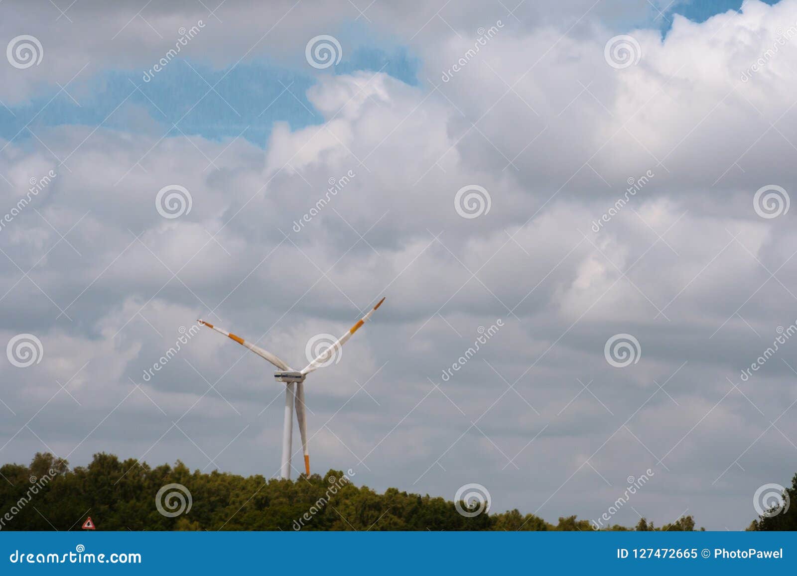 A Large Windmill on a Background of Blue Sky with White Clouds. Stock ...