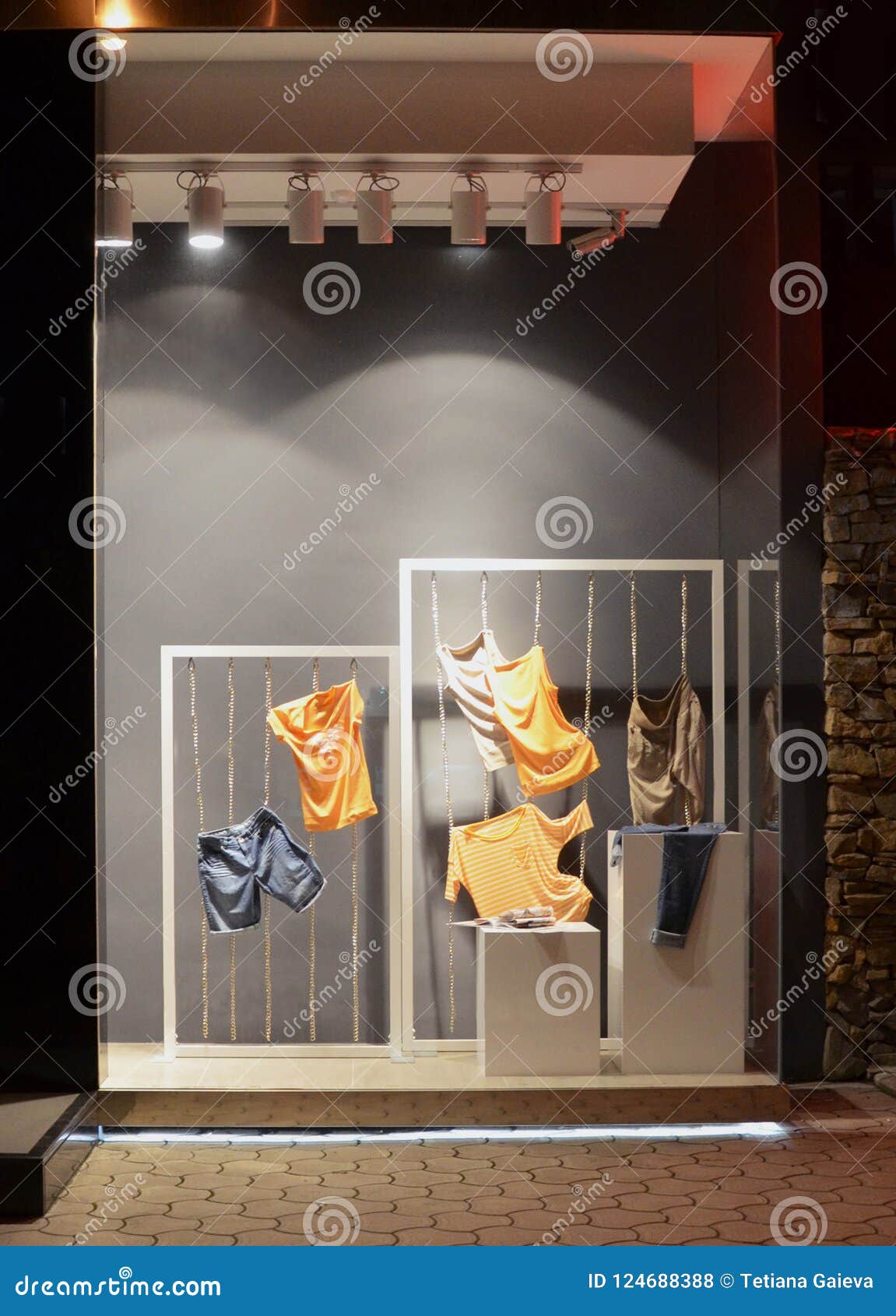 Large Window Showcase with T-shirts and Denim Shorts Stock Photo ...