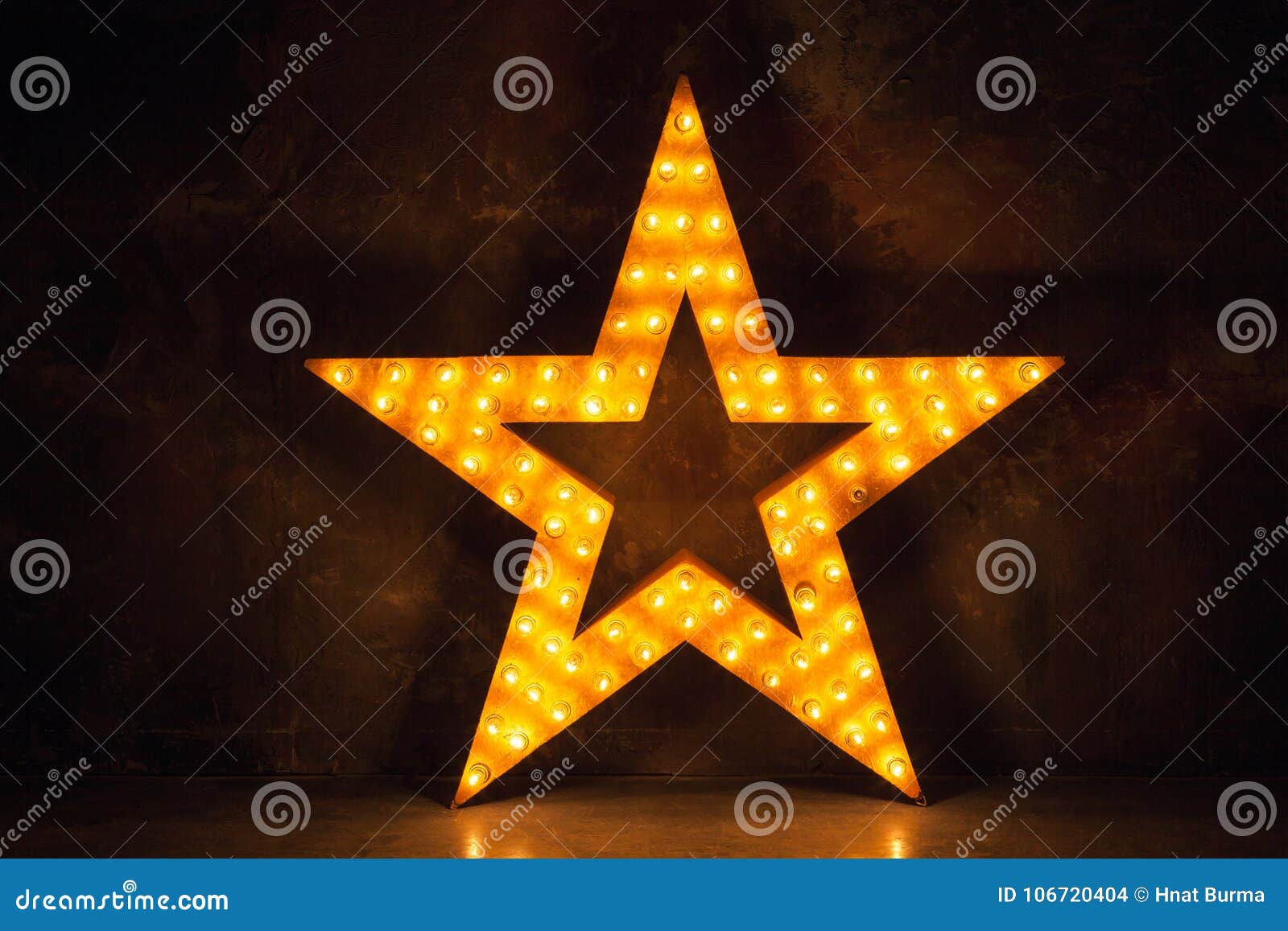 Large Wooden Star with a Large Amount of Lights in Front of Dark ...