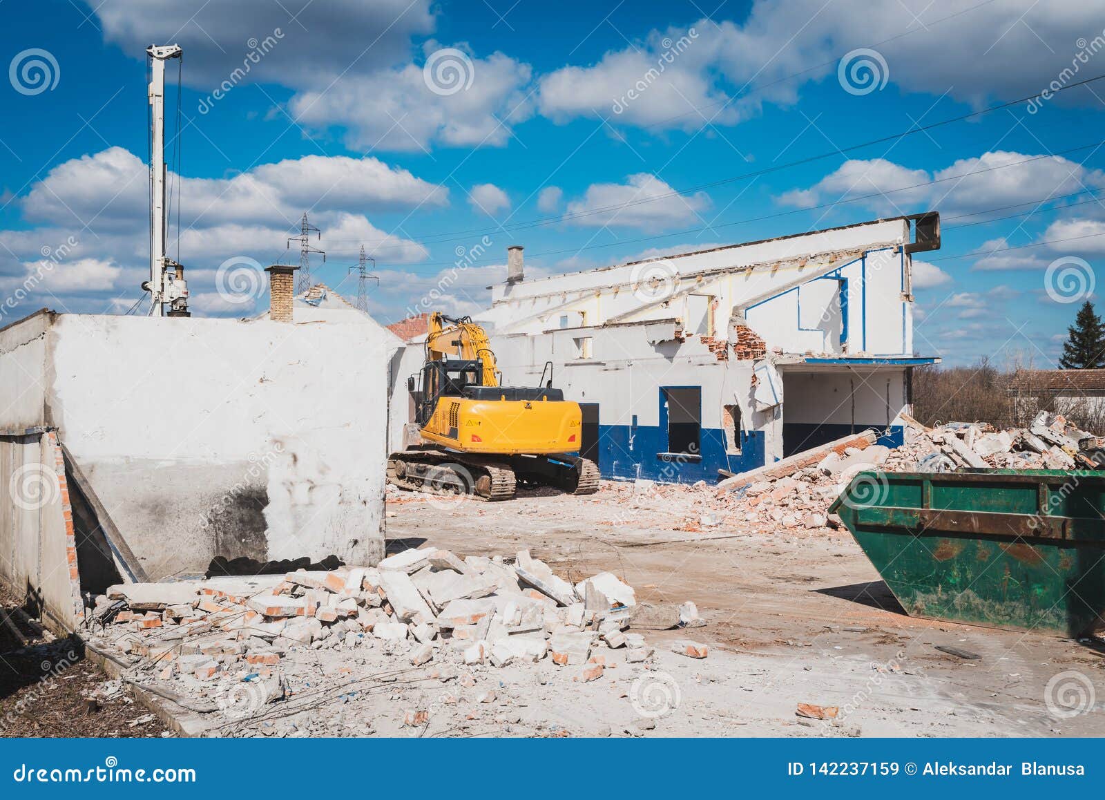 Large Construction Machines are Knocking Down the Houses on the ...