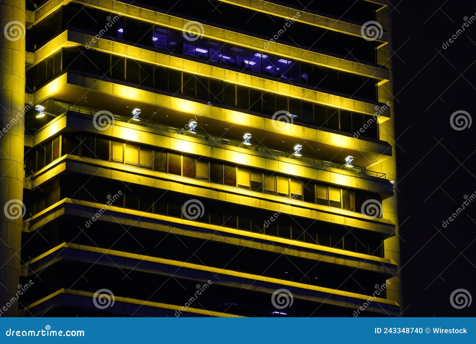 Large Yellow Illuminated Downtown Building at Night Stock Photo - Image ...